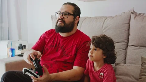 Father Setting Up Video Game Joystick Co... | Stock Video | Pond5