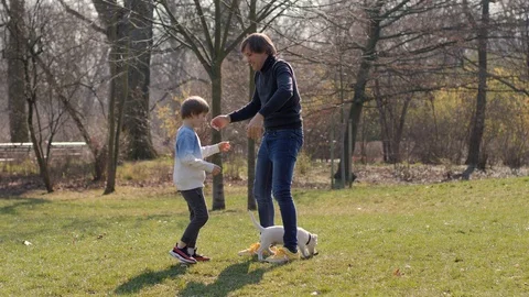 Father with son together play catch up t... | Stock Video | Pond5