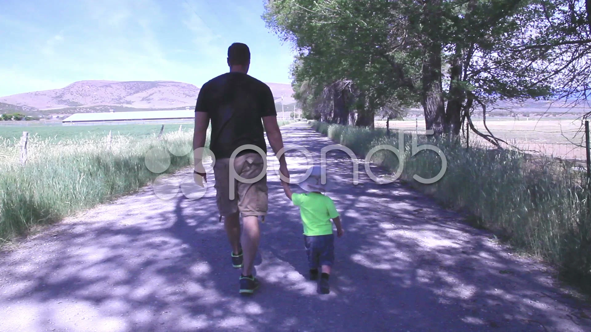 Father And Son Walking Away