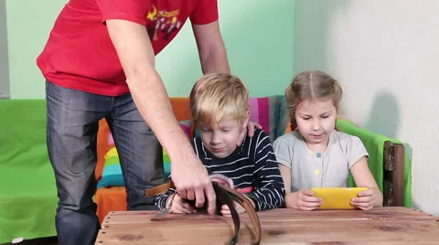 Father with strap in hands trying to gra... | Stock Video | Pond5