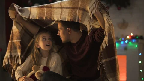 Father telling breathtaking X-mas story ... | Stock Video | Pond5