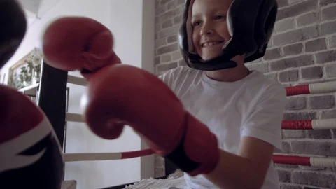 The father is training his son boxing. I... | Stock Video | Pond5