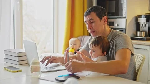 father working from home remotely with b... | Stock Video | Pond5