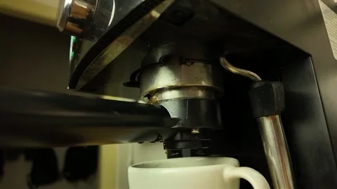 A faulty coffee machine leaks coffee out... | Stock Video | Pond5
