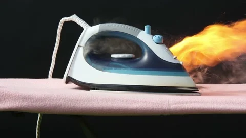 Faulty home appliance is burn, an iron f... | Stock Video | Pond5