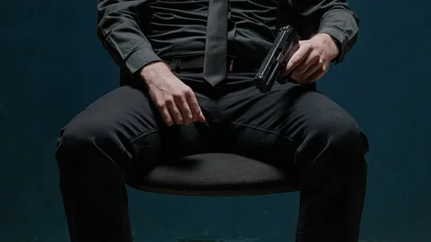 FBI agent holds service pistol in his ha... | Stock Video | Pond5