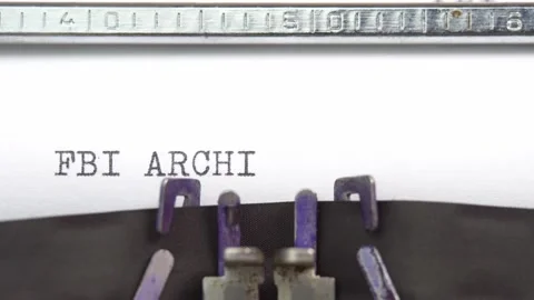 FBI Archives phrase closeup being typing... | Stock Video | Pond5