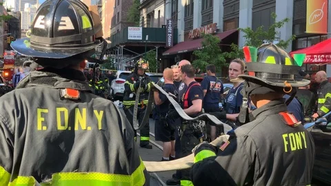FDNY firefighter in uniform suit gear sc... | Stock Video | Pond5