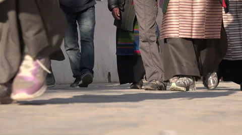 Feet and legs of pilgrims walking around... | Stock Video | Pond5