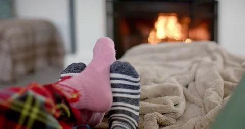 Feet of couple in socks relaxing at home... | Stock Video | Pond5