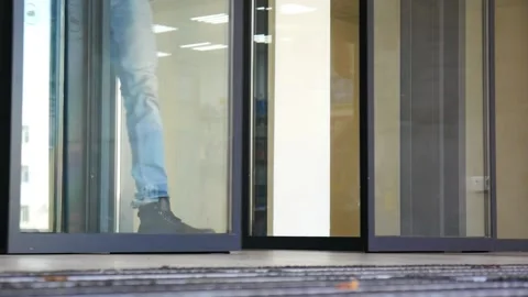 The feet of a man leaving the building t... | Stock Video | Pond5