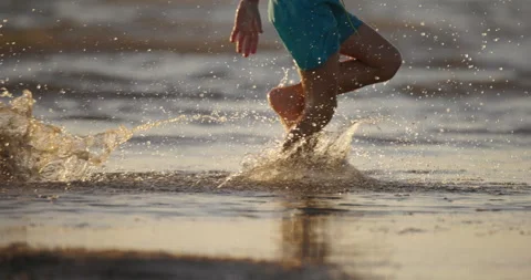 Feet running on the sand on beach, slow ... | Stock Video | Pond5