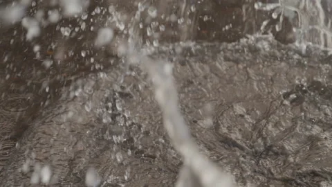 Feet Running Through Puddle Making Big S... | Stock Video | Pond5