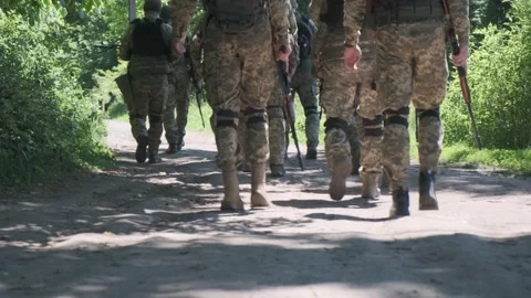 The feet of soldiers walking through the... | Stock Video | Pond5