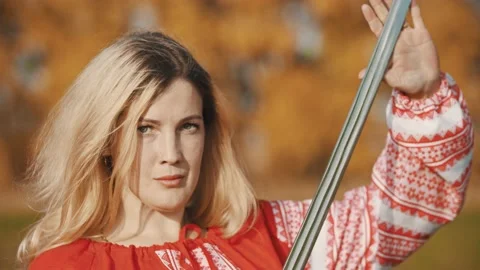 Feisty woman in red clothes standing on ... | Stock Video | Pond5