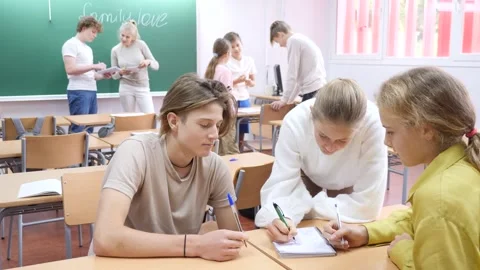 Fellow students having group work tasks ... | Stock Video | Pond5