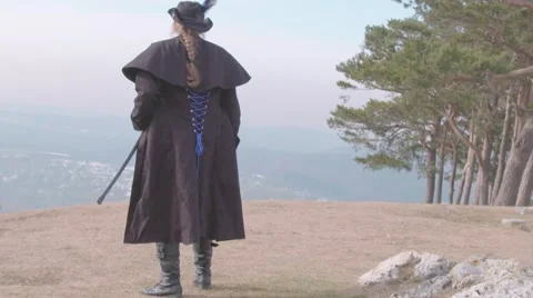 Female adventuerer drawing pistol | Stock Video | Pond5