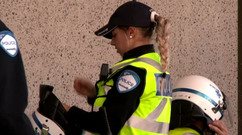 Female and male riot officers donning un... | Stock Video | Pond5