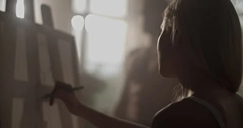 Female artist looking at model while dra... | Stock Video | Pond5