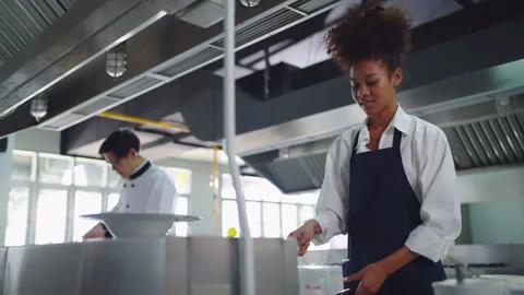 Female asian chef working at kitchen, sh... | Stock Video | Pond5