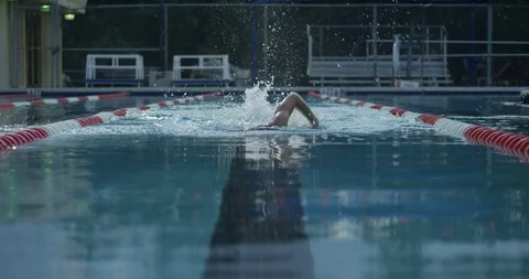 Female athlete swimming in a pool toward... | Stock Video | Pond5
