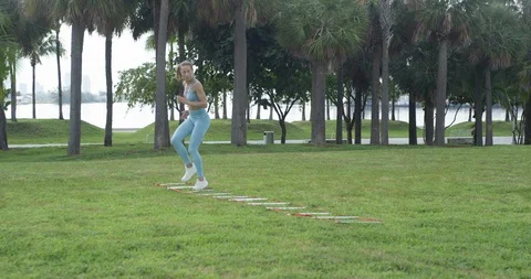 Female athlete training on an agility la... | Stock Video | Pond5