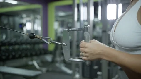 Female athlete working out pulling weigh... | Stock Video | Pond5