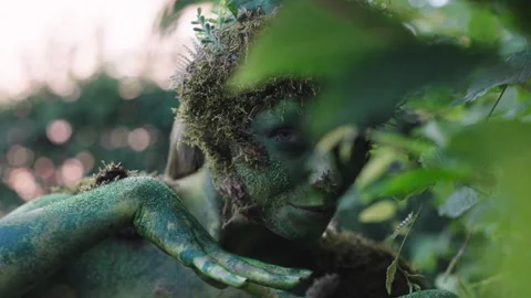 Female bodypaint model gazing and smirki... | Stock Video | Pond5