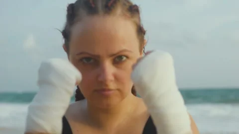 Female boxer MMA fighter looks at camera... | Stock Video | Pond5