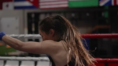 Female boxer performing shadow fight dur... | Stock Video | Pond5