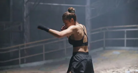 Female boxer practising shadow boxing in... | Stock Video | Pond5