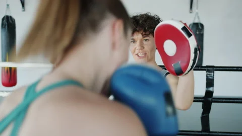 Female boxing coach motivating student y... | Stock Video | Pond5