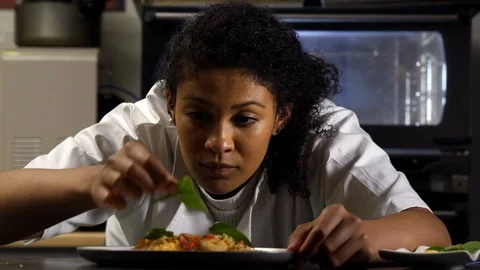 Female Chef Garnishing Plate Of Food In ... | Stock Video | Pond5
