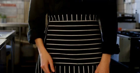 Female chef standing in the commercial k... | Stock Video | Pond5