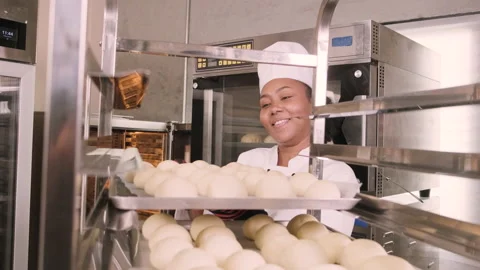 Female chef in uniform prepare to bake b... | Stock Video | Pond5