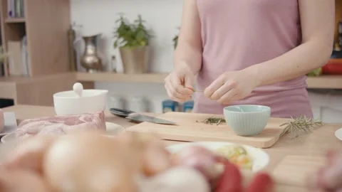 Female cook hand prepares rosemary spice... | Stock Video | Pond5