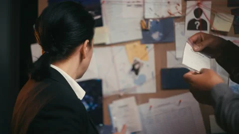 Female detective showing evidence bullet... | Stock Video | Pond5