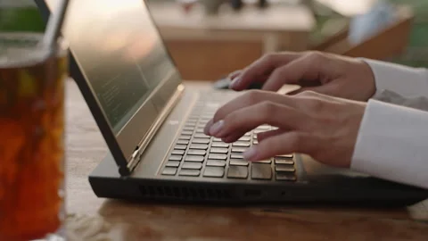 Female dev typing on laptop keyboard in ... | Stock Video | Pond5