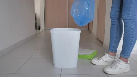 female do replacing garbage bag in kitch... | Stock Video | Pond5