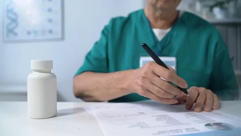 Female doc filling patient medication fo... | Stock Video | Pond5