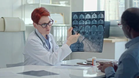 Female Doctor Explaining MRI Scan to Pat... | Stock Video | Pond5