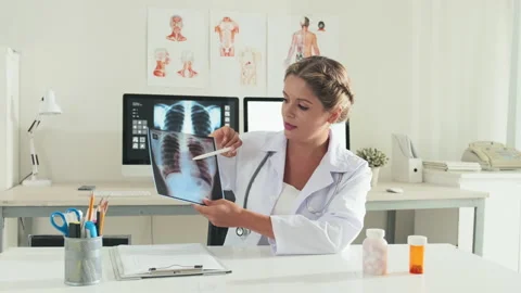 Female Doctor Explaining X Ray Scan on C... | Stock Video | Pond5