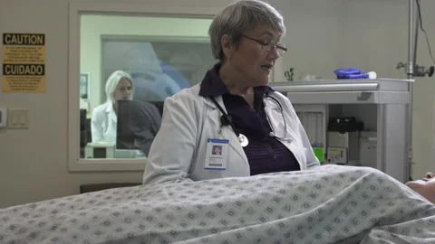 Female doctor preparing patient at MRI s... | Stock Video | Pond5