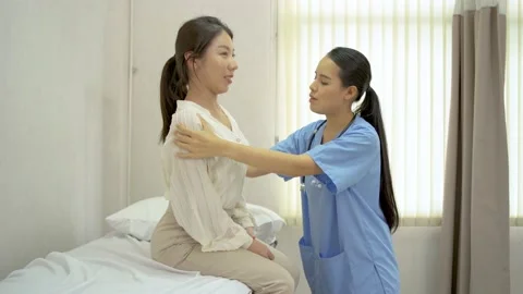 Female doctor treating woman patient wit... | Stock Video | Pond5