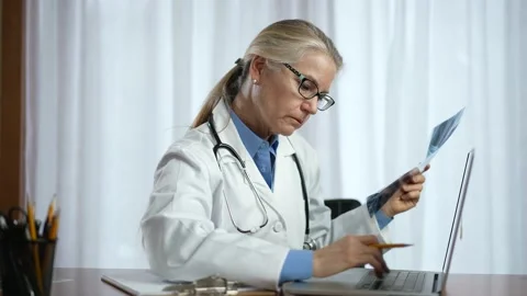 Female doctor wearing lab coat and steth... | Stock Video | Pond5