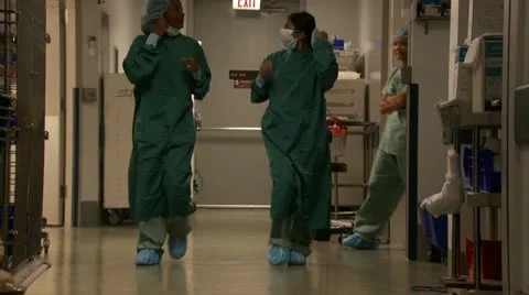 Female doctors and nurses in scrubs walk... | Stock Video | Pond5