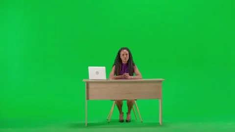 Female in dress sit at the desk isolated... | Stock Video | Pond5