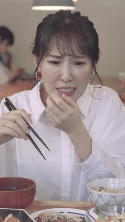 Female facial expressions while eating | Stock Video | Pond5