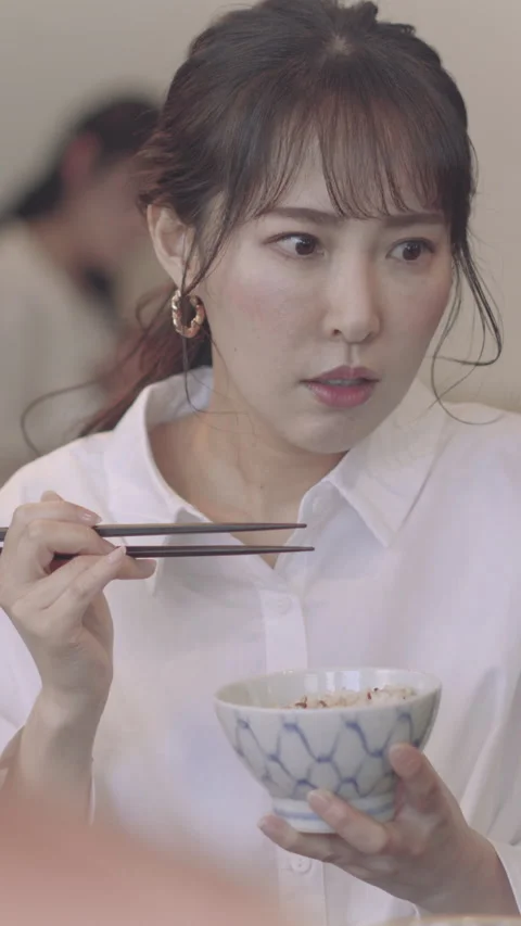 Female facial expressions while eating | Stock Video | Pond5