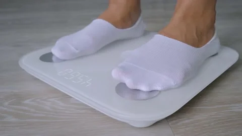 Female feet in socks stepping on digital... | Stock Video | Pond5